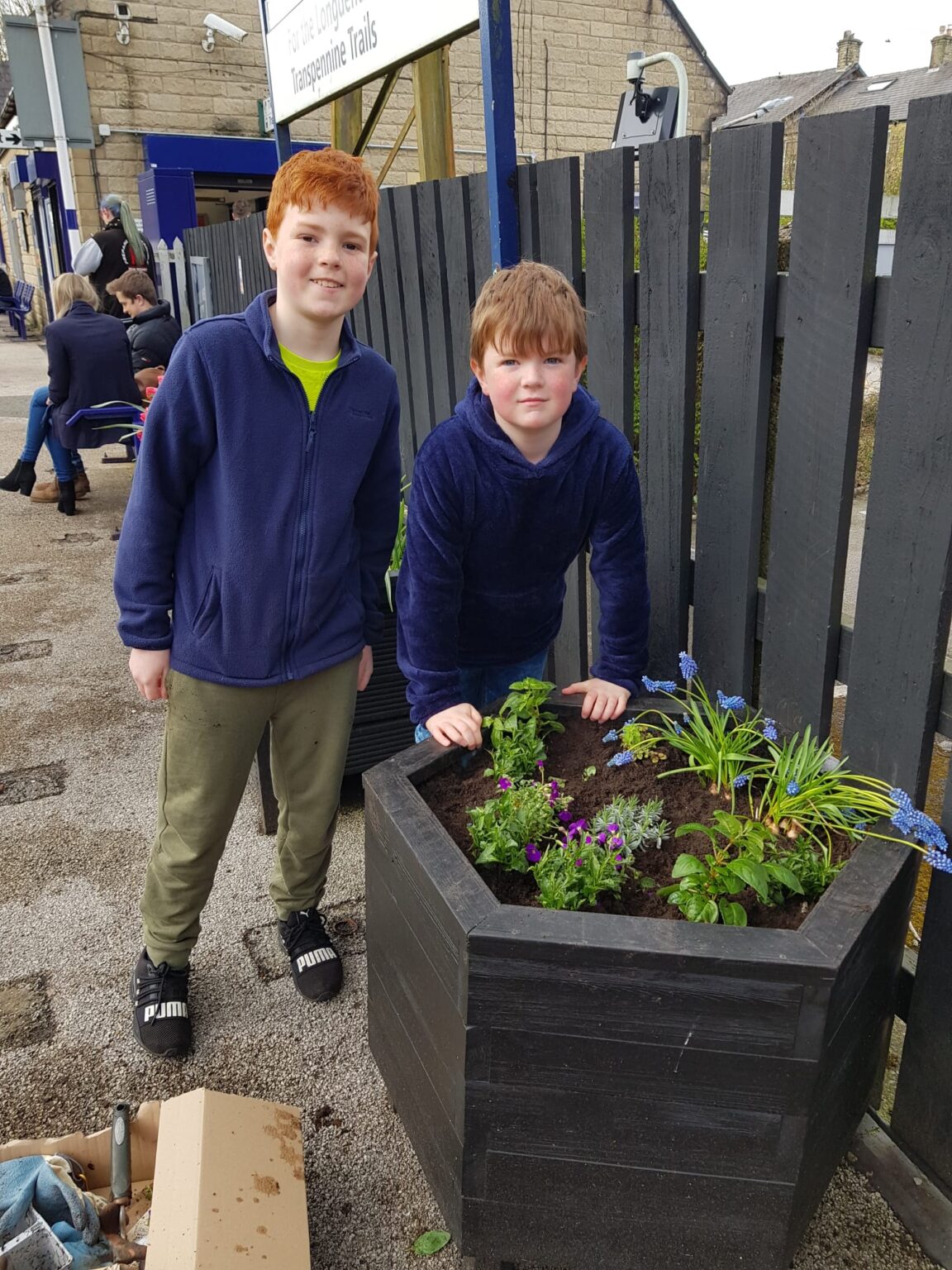 School pupils buzzing over new planter at Hadfield Station! - Community ...